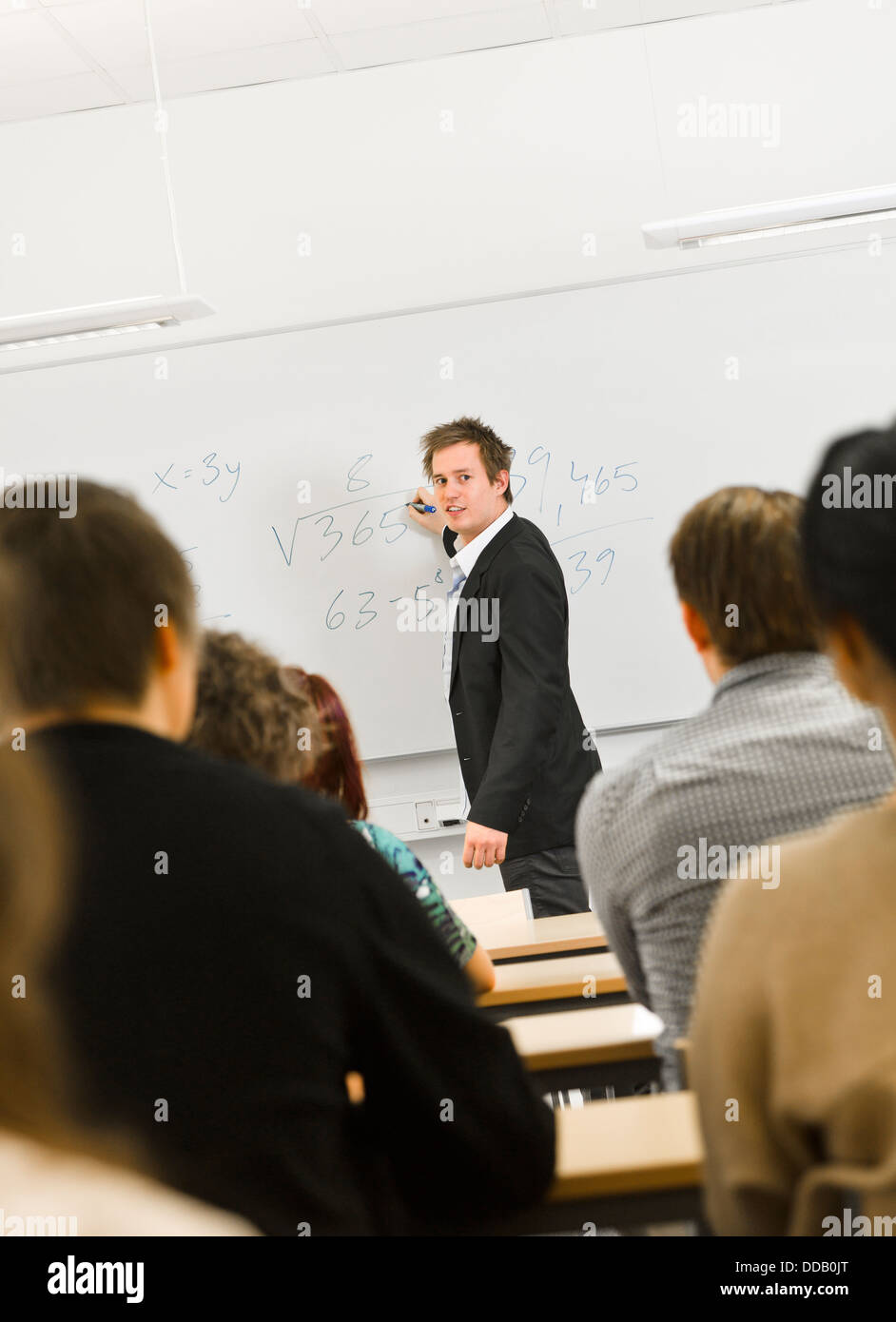 Teacher in classroom Stock Photo - Alamy
