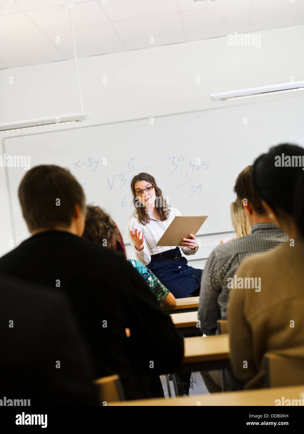 Teacher in classroom Stock Photo - Alamy