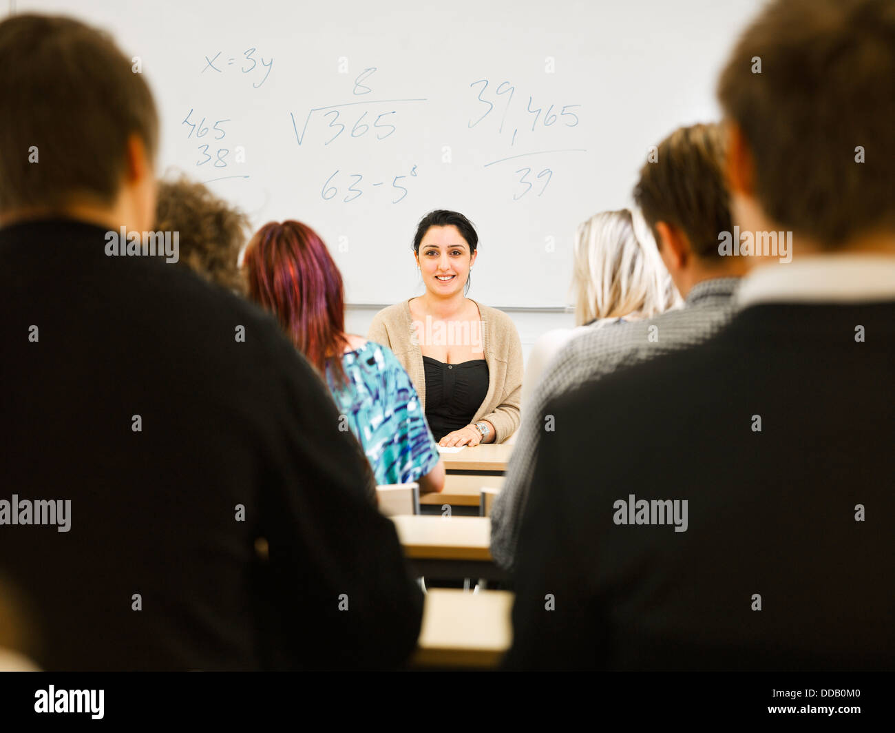 Teacher in classroom Stock Photo - Alamy