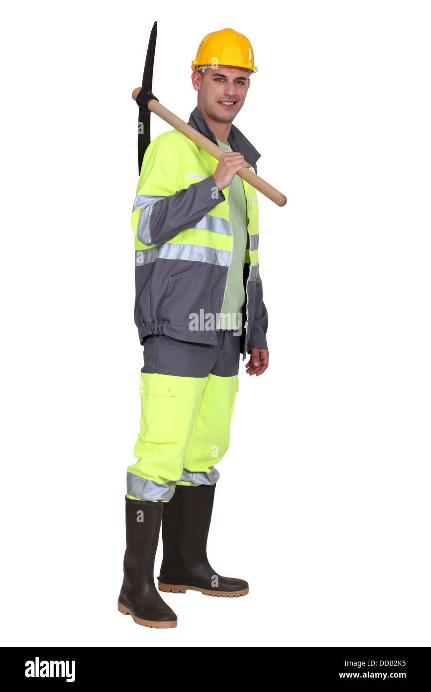 portrait of bricklayer standing with pickaxe over his shoulder Stock ...