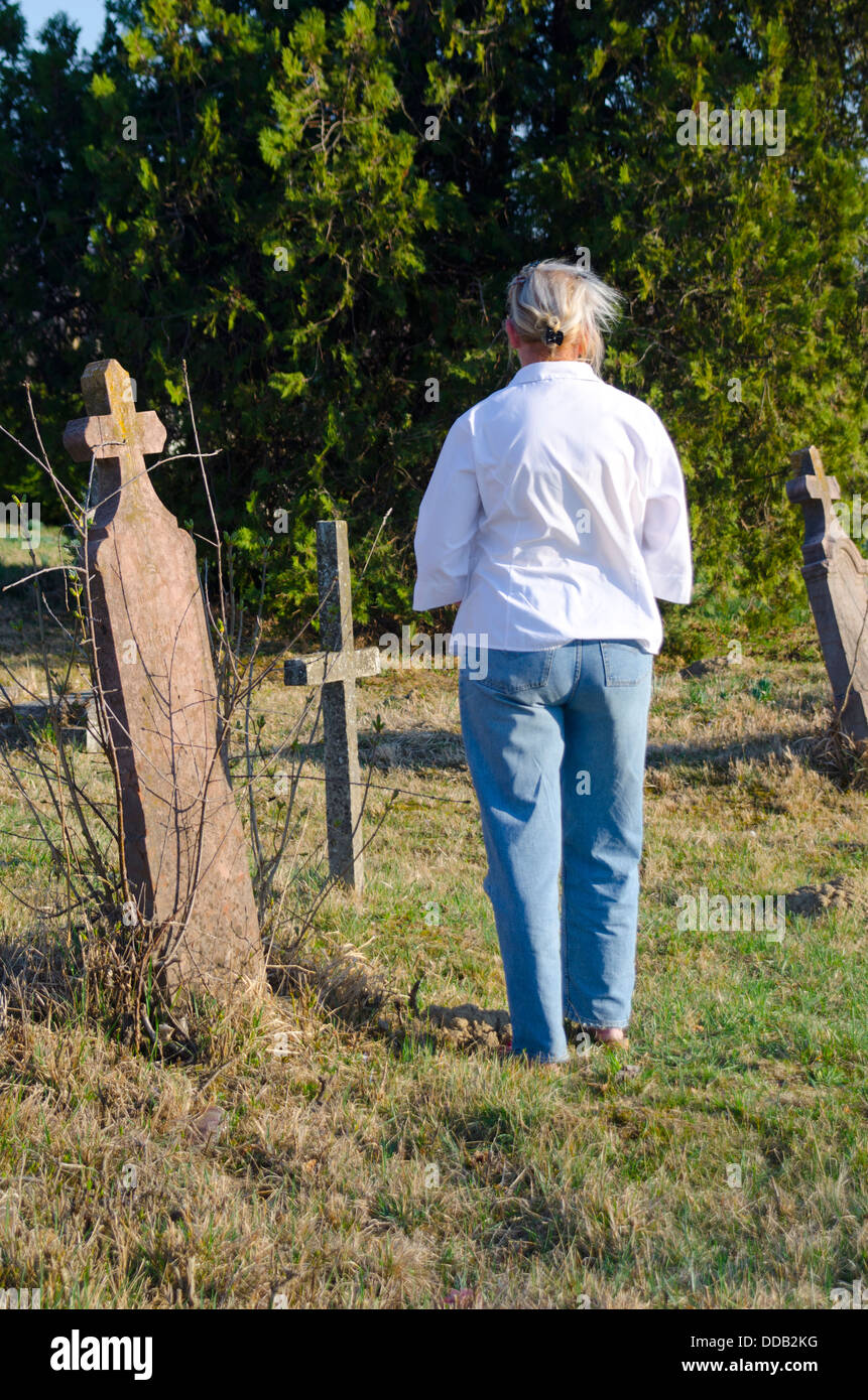 woman walks through an old cemetery Stock Photo - Alamy