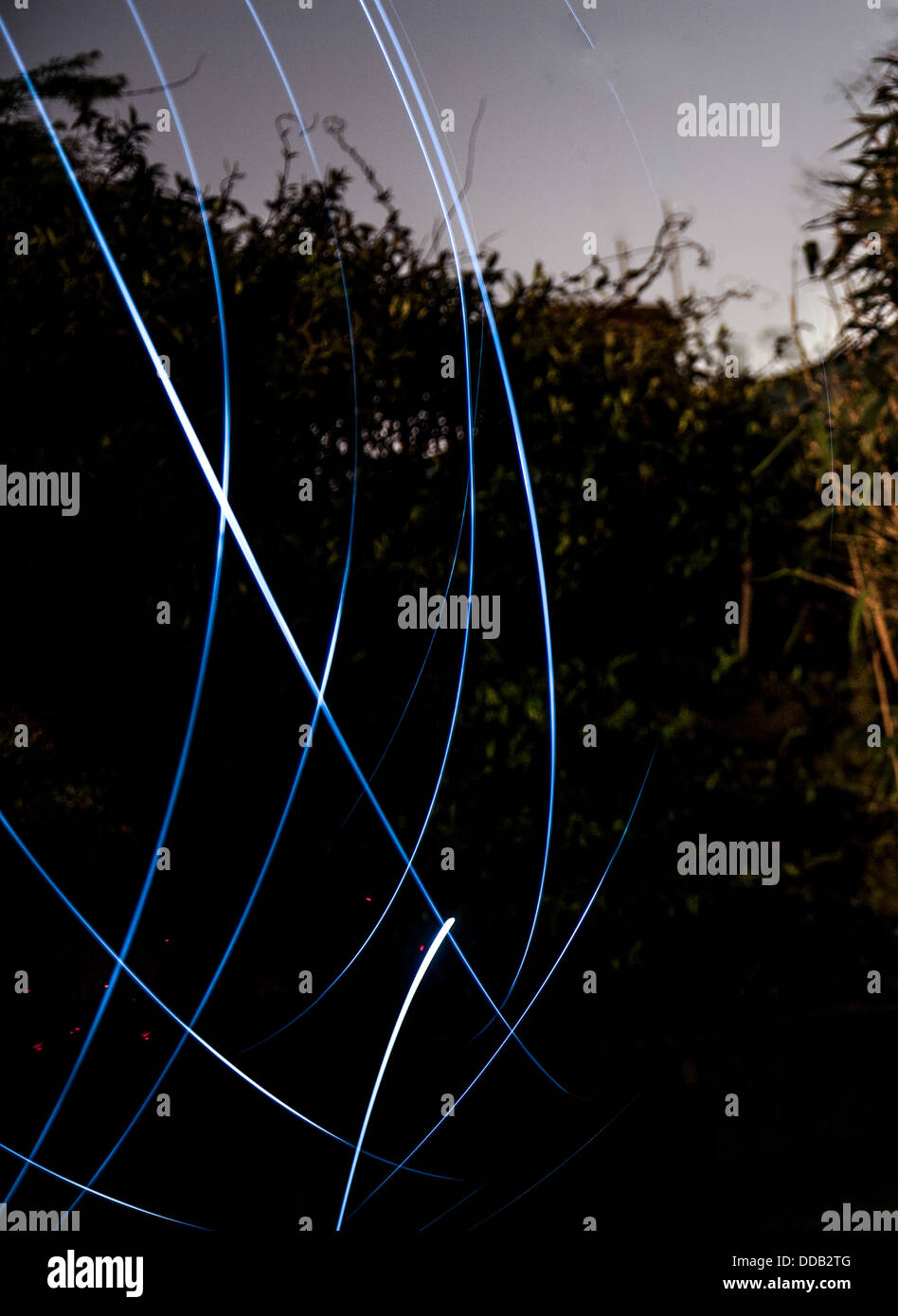 Circular light streams on a dark outdoor background Stock Photo - Alamy