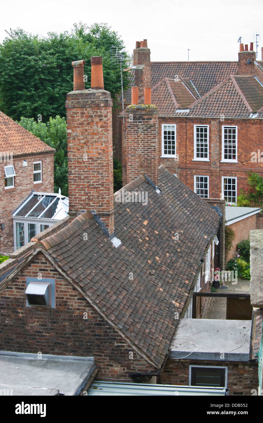 View over rooftops of traditional housing within the city walls of York ...