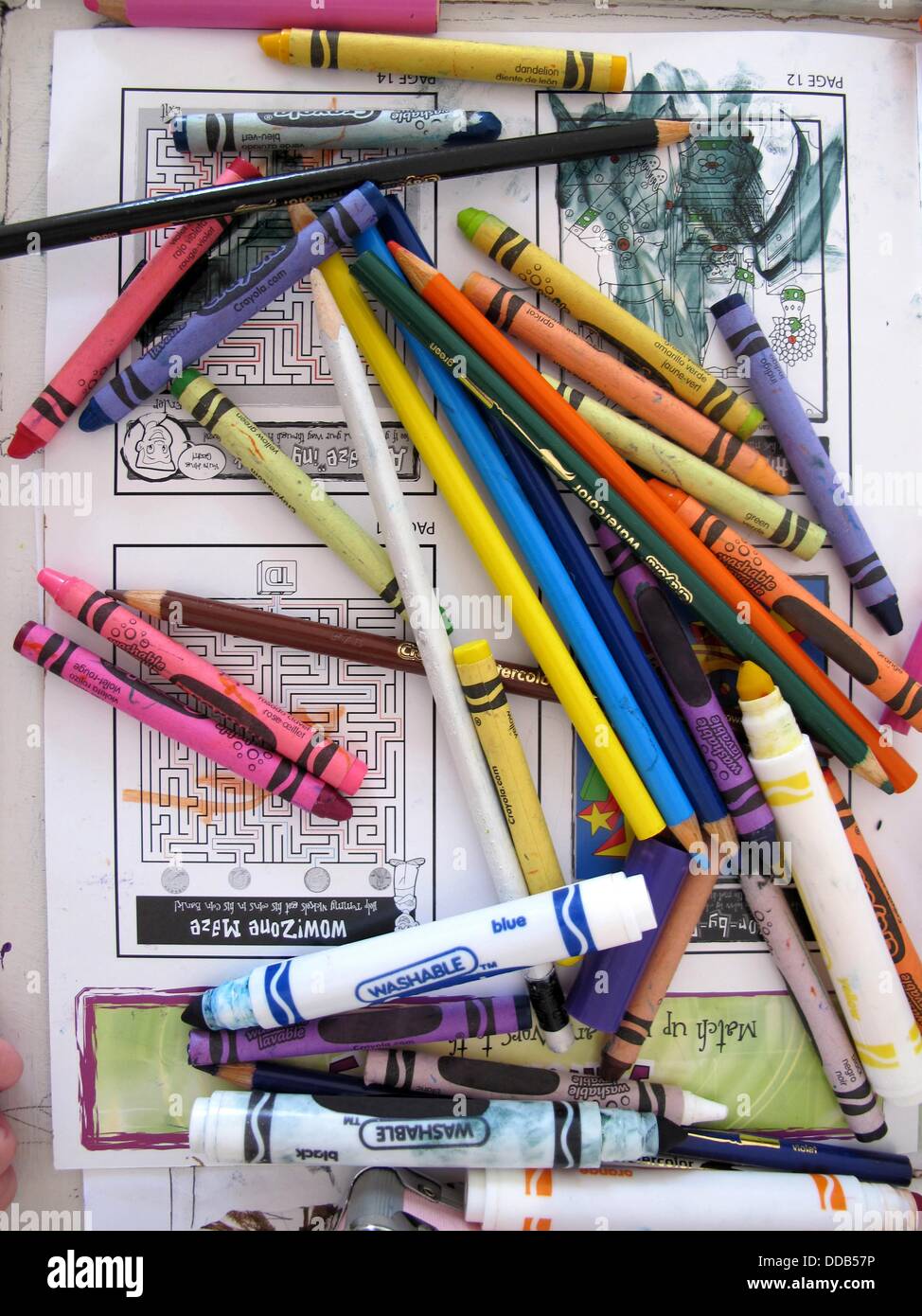 A table of pens and crayons during an arts and crafts session Stock ...
