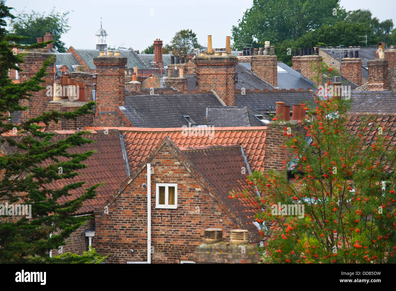 View over rooftops of traditional housing within the city walls of York ...