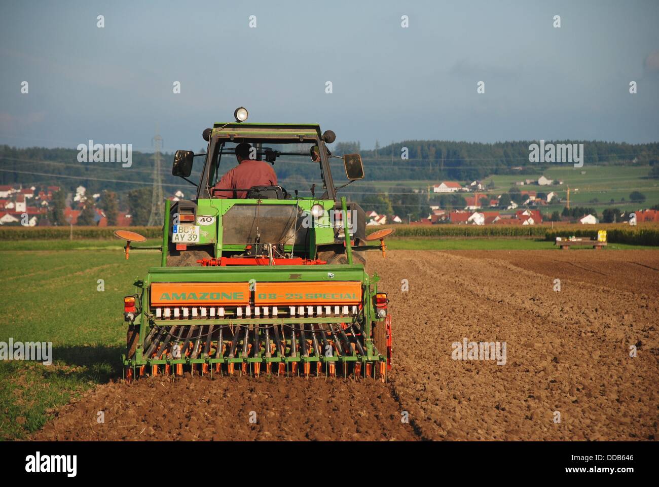Farmer sows a field Stock Photo - Alamy