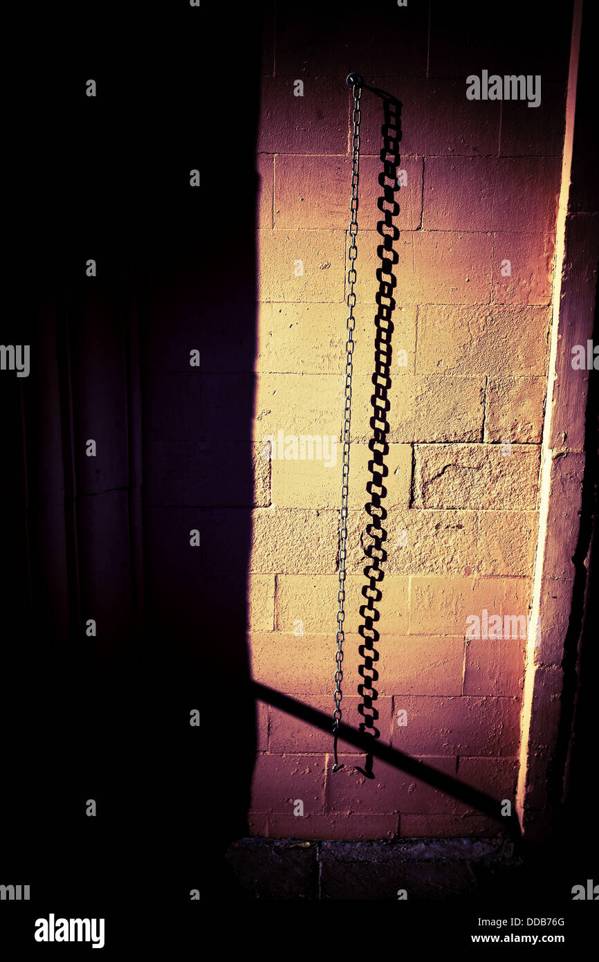 Chain on the wall Stock Photo - Alamy