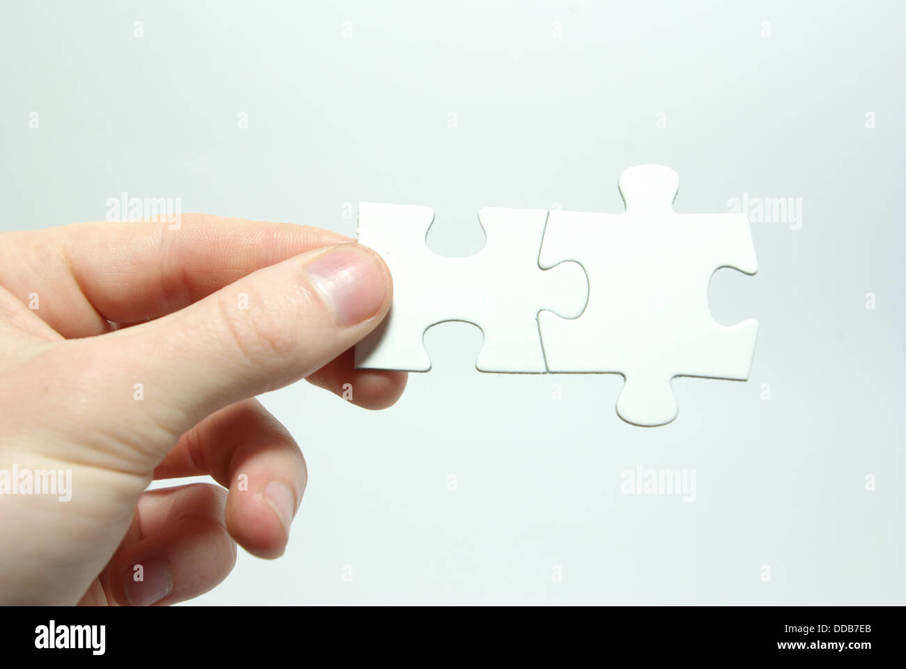 puzzle in hand Stock Photo - Alamy
