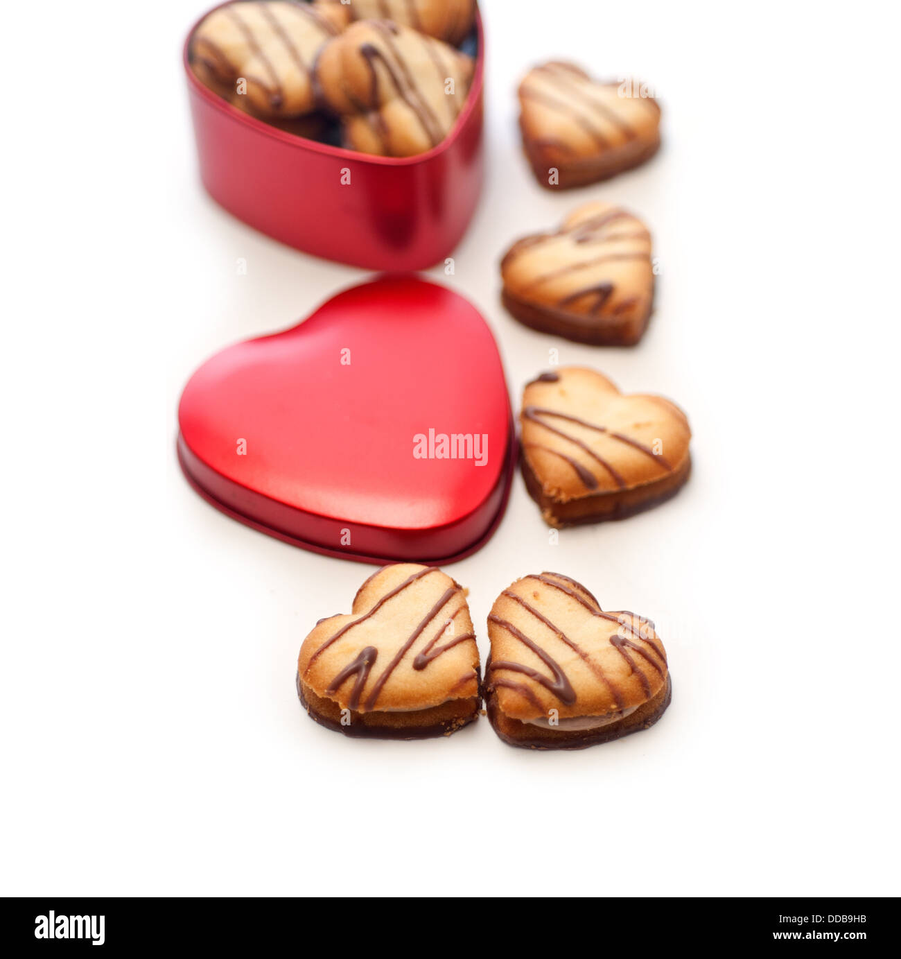 heart shaped cream cookies on red heart metal box Stock Photo - Alamy