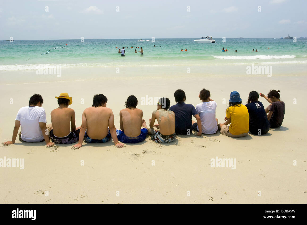 Group of young students on the beach in the school brack in Thailand ...