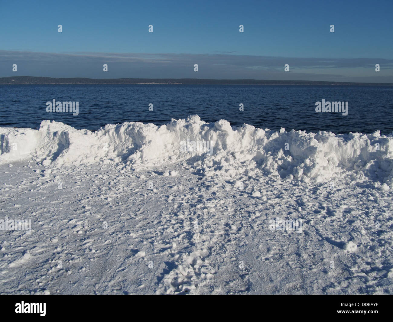 Snowdrift on the lake Stock Photo - Alamy