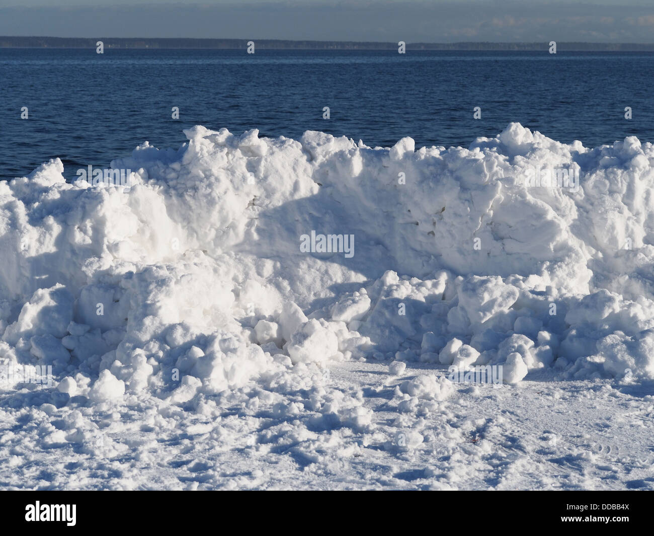 Snowdrift on the lake Stock Photo - Alamy