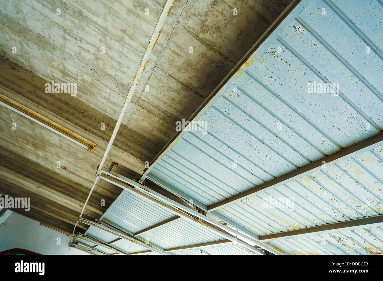 A industrial garage ceiling with open gates Stock Photo - Alamy