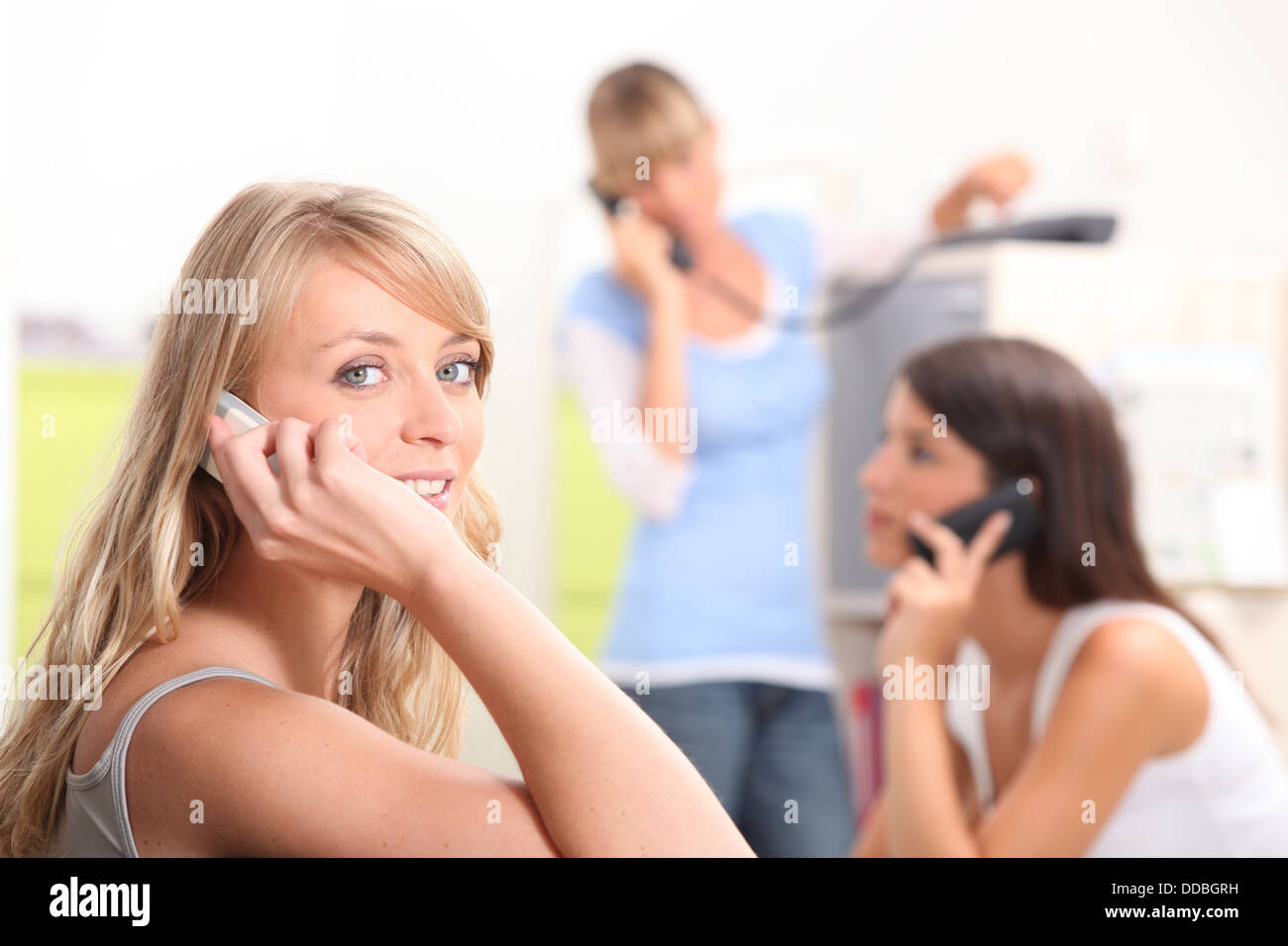 Group of girls on the phone Stock Photo - Alamy