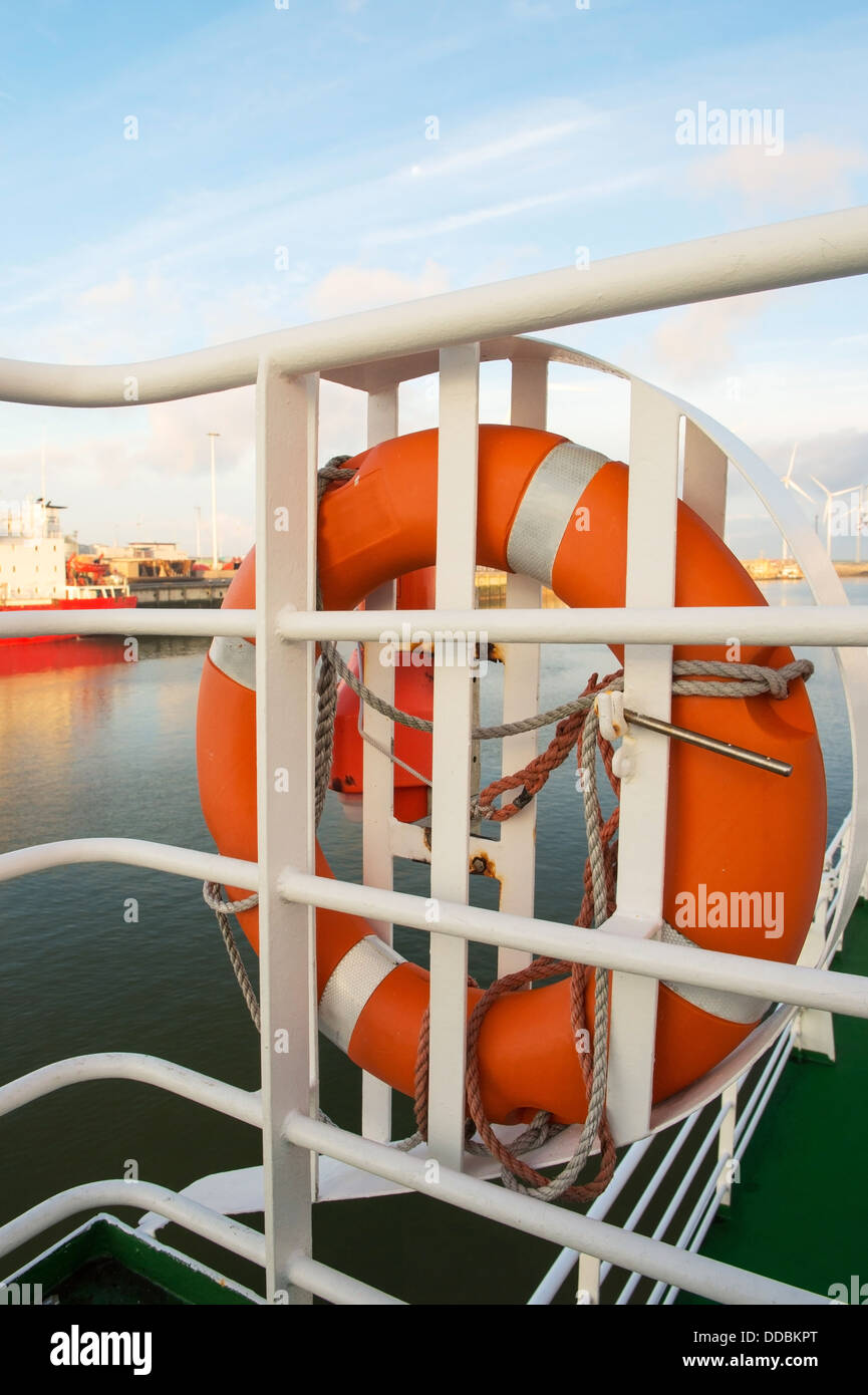 Life buoy on boat in harbor Stock Photo - Alamy