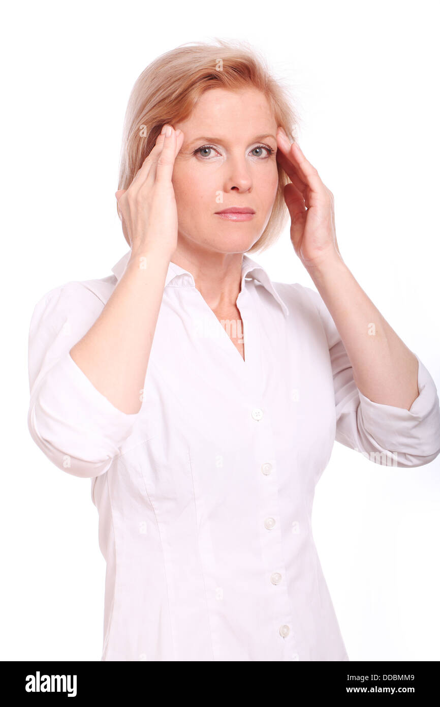 Beautiful mid aged woman touching her head Stock Photo - Alamy