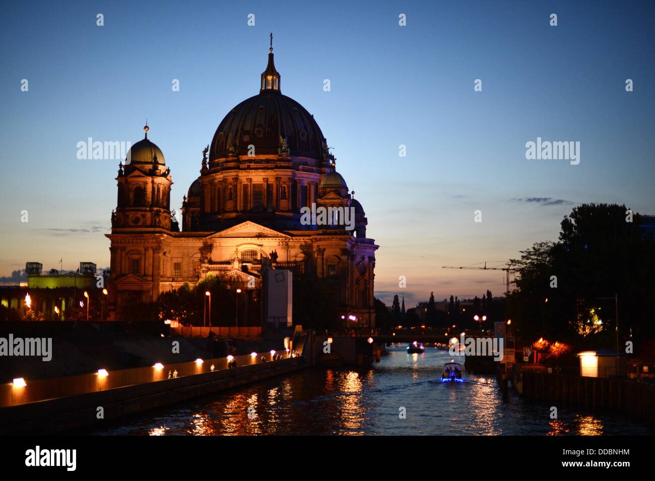 The illuminated Berlin Cathedral and a tour ship are pictured from the ...