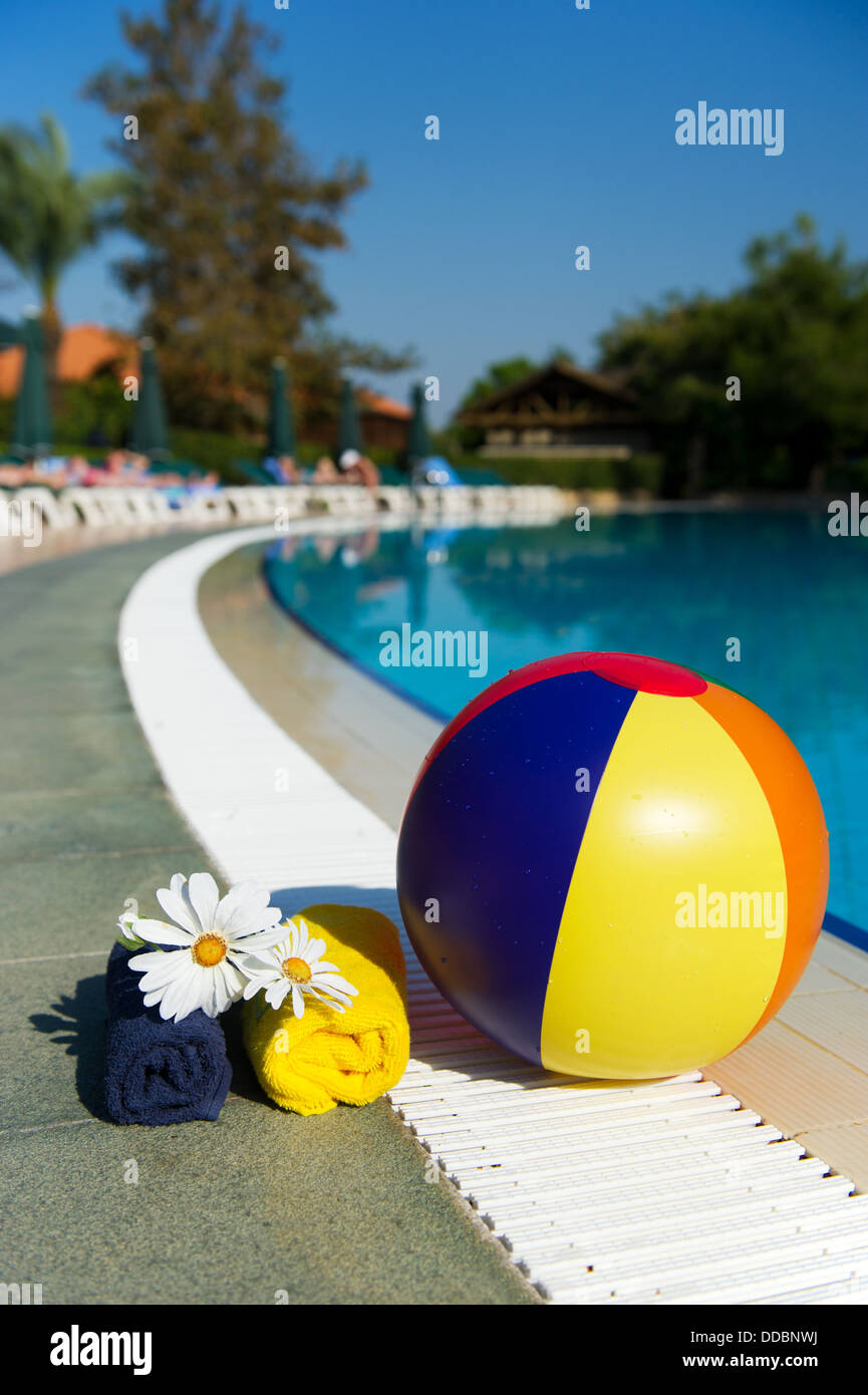 Beach ball at swimming pool Stock Photo - Alamy