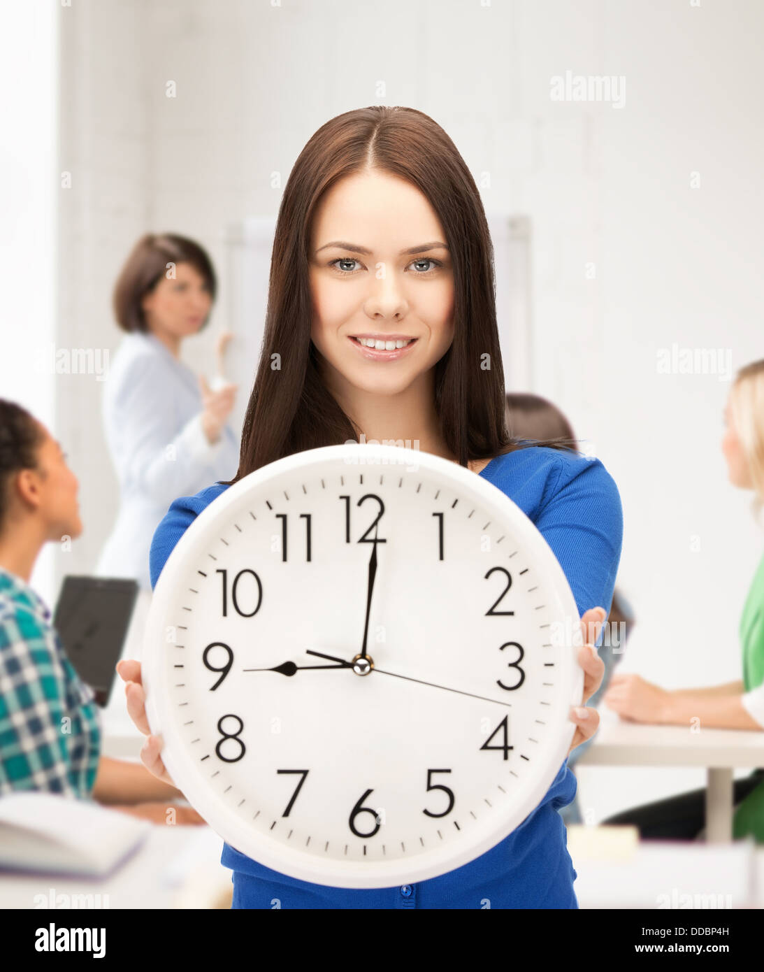 student showing clock Stock Photo - Alamy