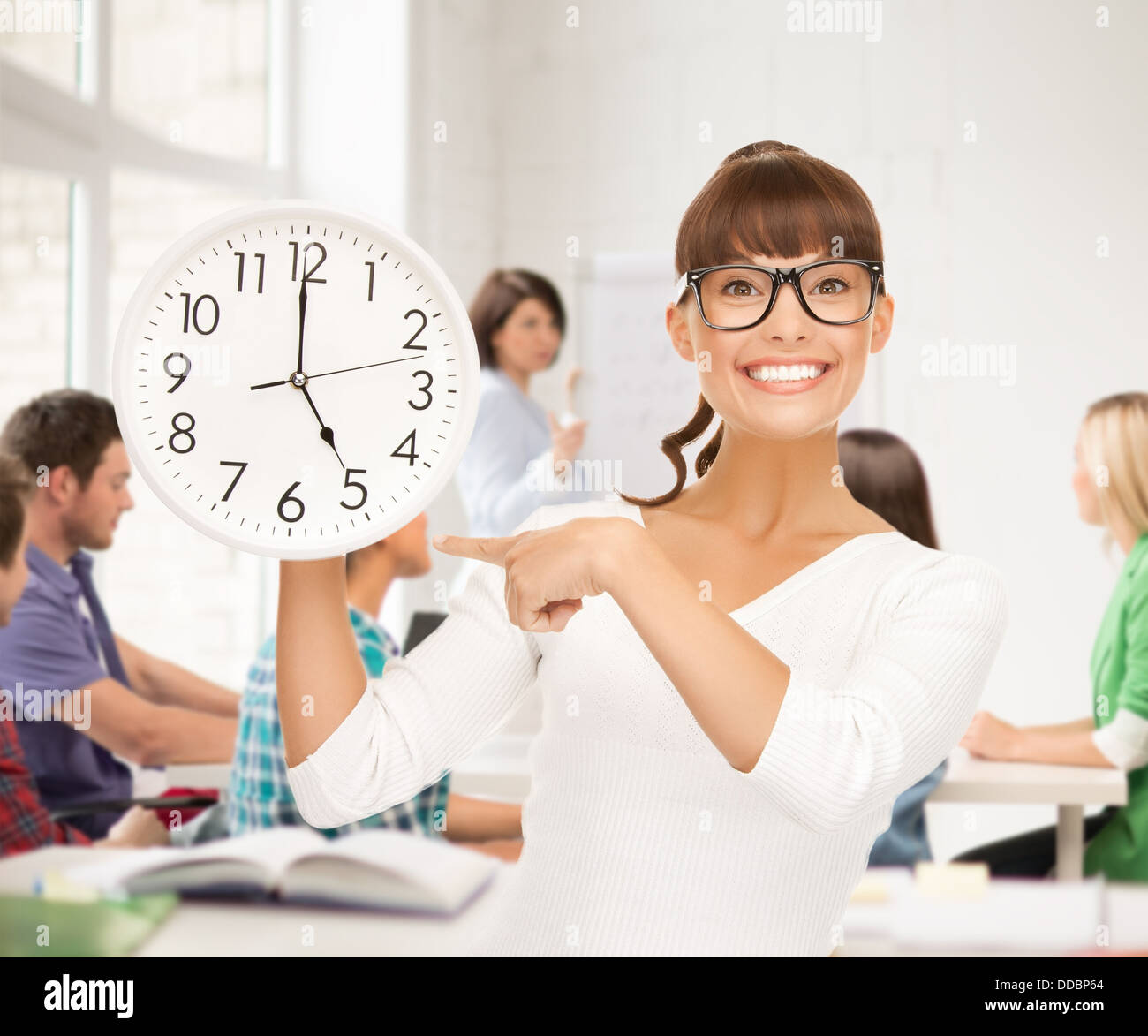 student showing clock Stock Photo - Alamy