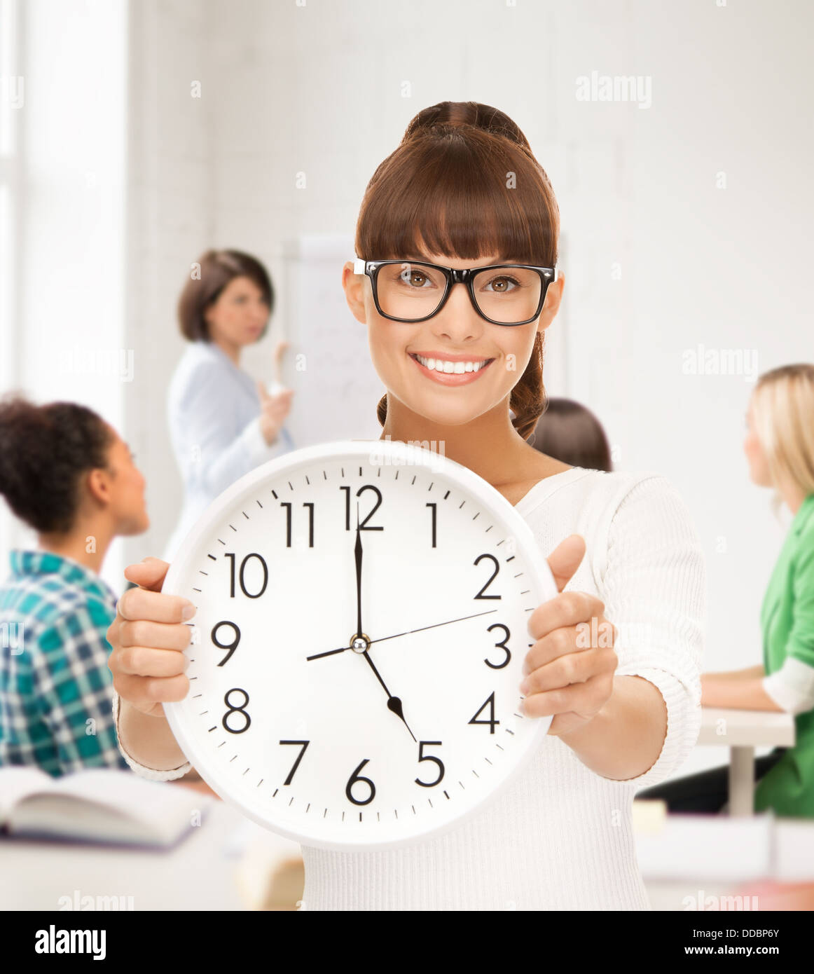 student showing clock Stock Photo - Alamy