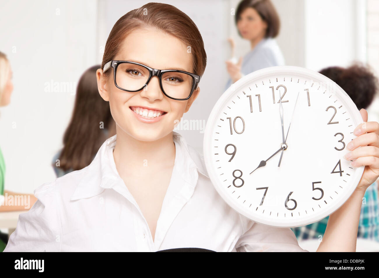 student showing clock Stock Photo - Alamy