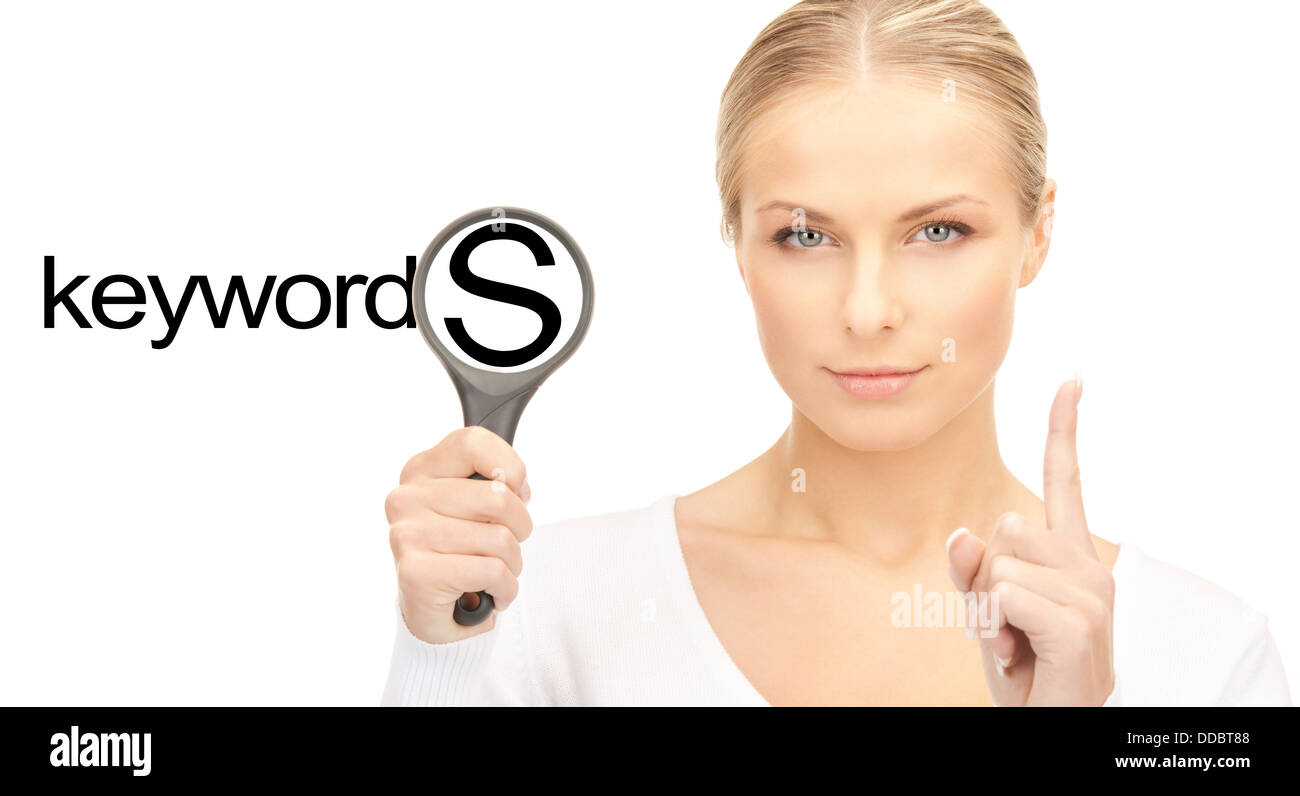 woman with magnifying glass and keywords word Stock Photo - Alamy