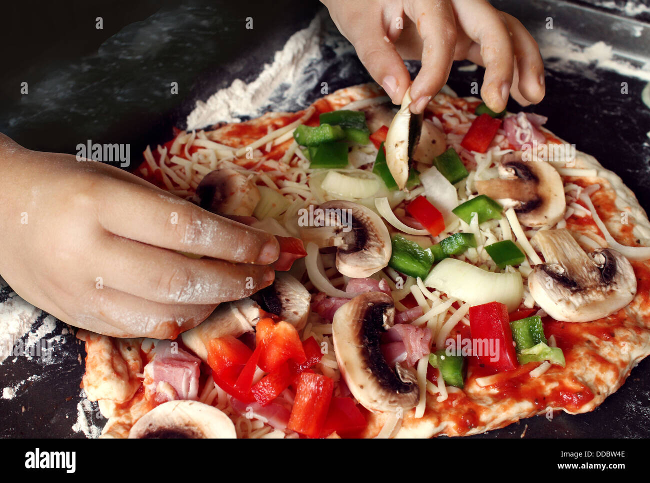 Child preparing pizza Kids Making Pizzas with the hands of a kid ...