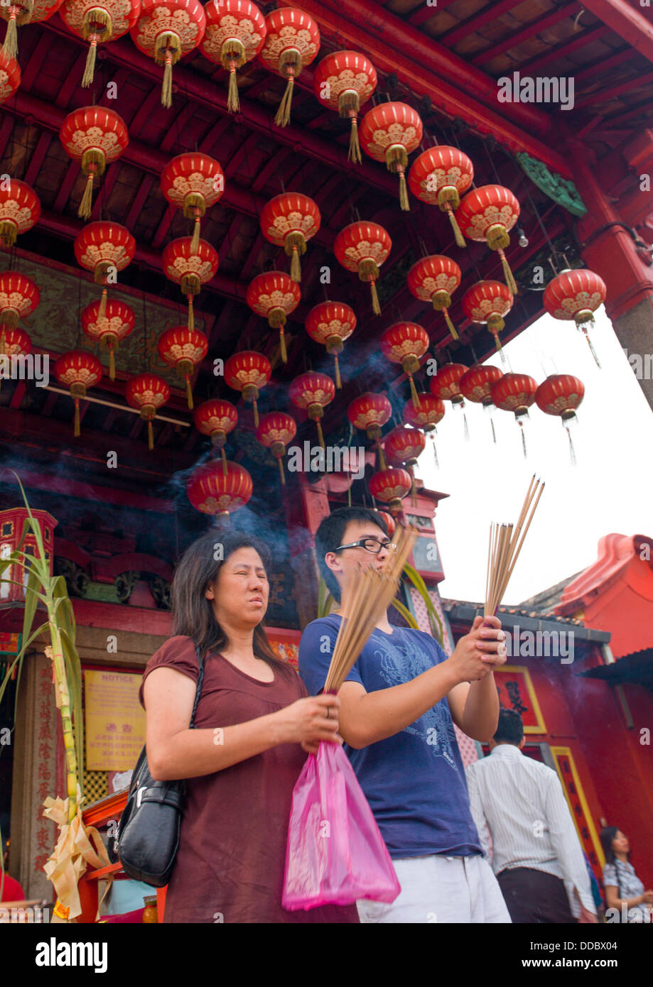 People Praying In A Temple Under Lanterns, George Town, Penang ...