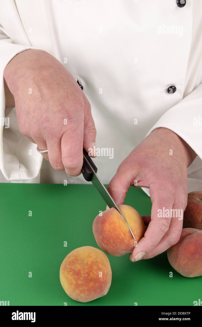 female chef preparing a peach Stock Photo - Alamy