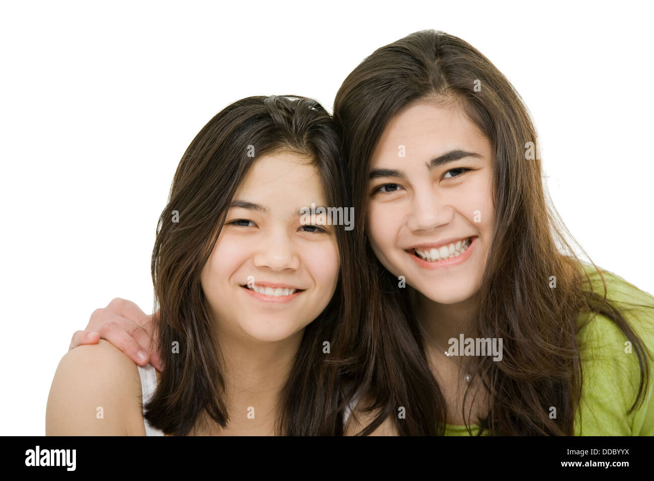 Two sisters together, isolated on white Stock Photo - Alamy