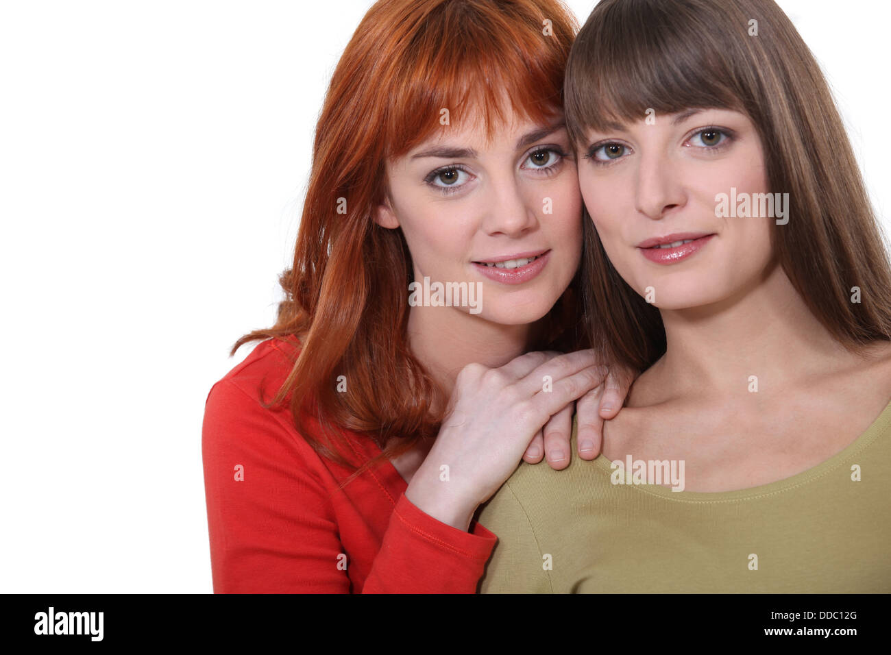 Sisters posing for the camera Stock Photo - Alamy