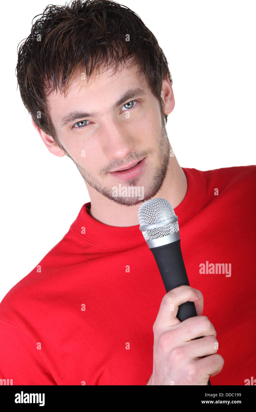 Man holding microphone Stock Photo - Alamy