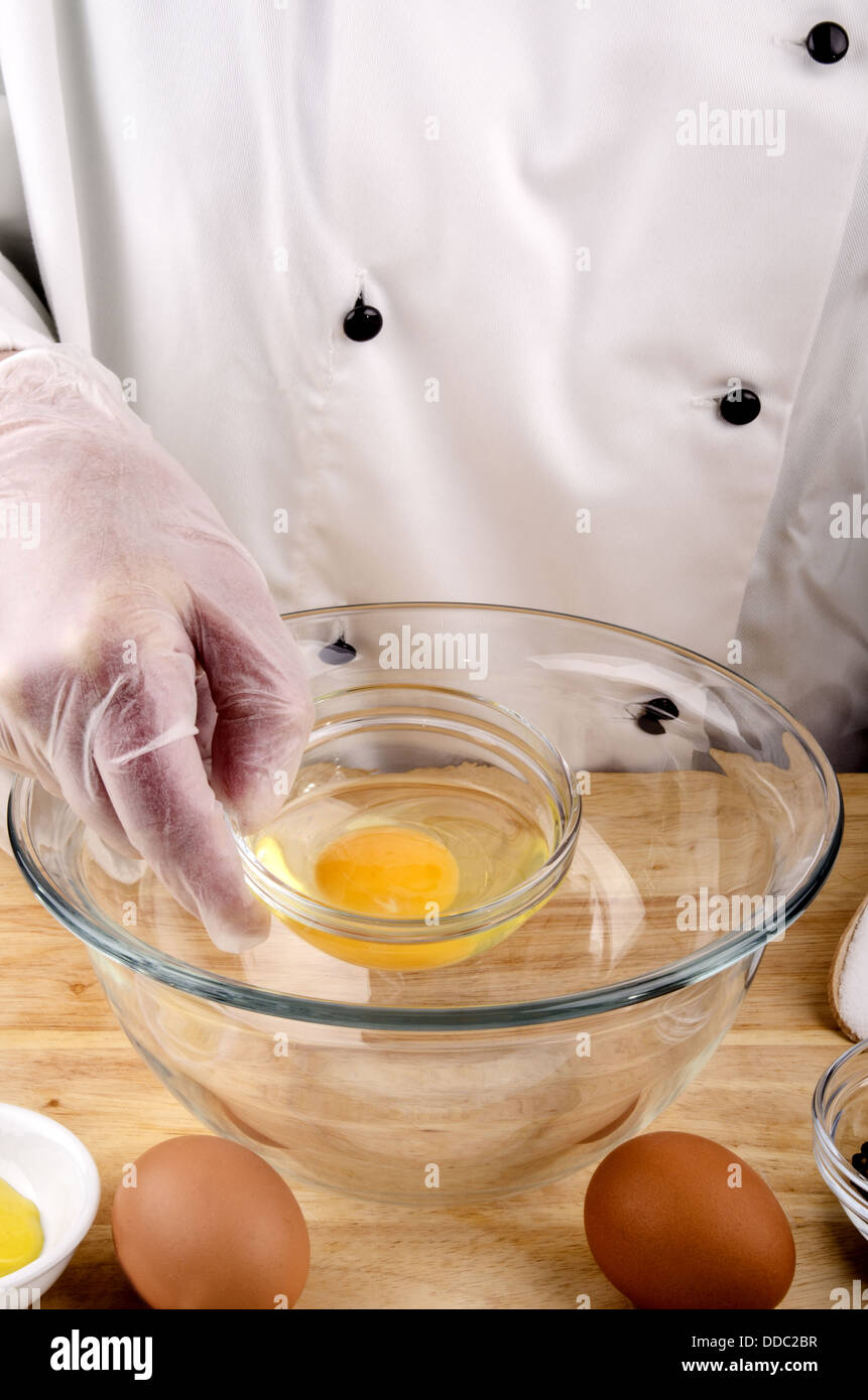 chef has an egg in a small bowl Stock Photo - Alamy