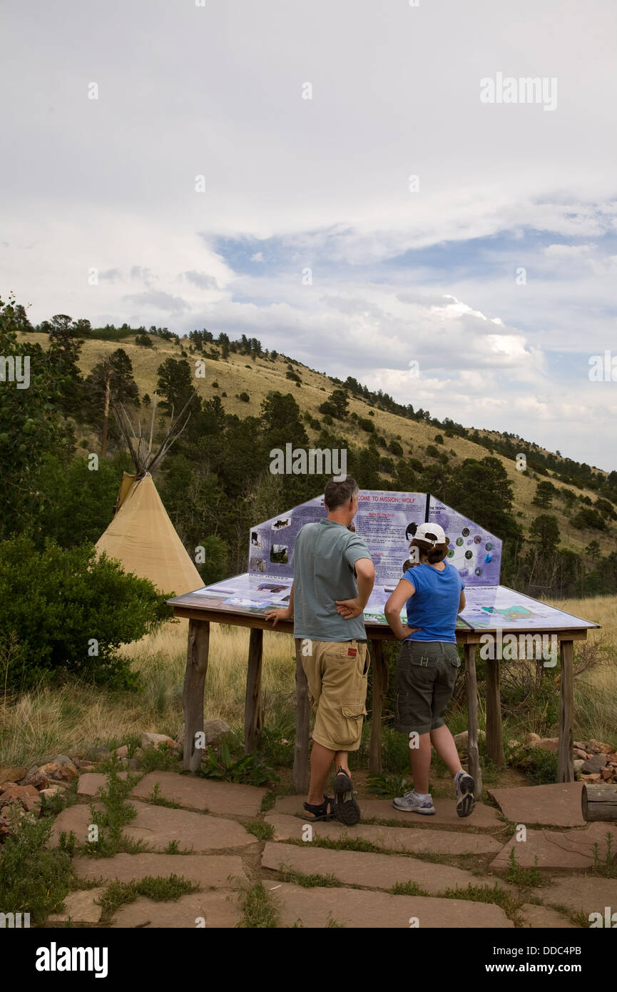 Visitors peruse a storyboard introducing mission wolf hi-res stock ...