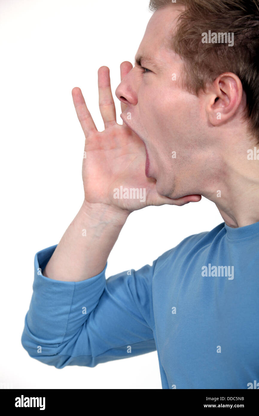 young man in profile shouting Stock Photo - Alamy