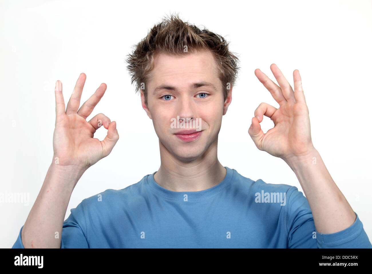 Man making double OK sign Stock Photo - Alamy