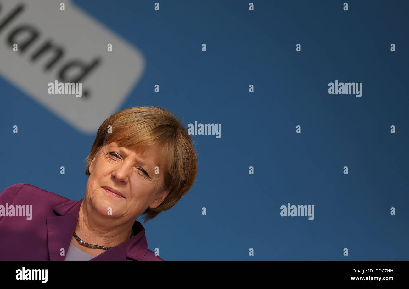 Olpe, Germany. 30th Aug, 2013. German Chancellor Angela Merkel (CDU) is ...