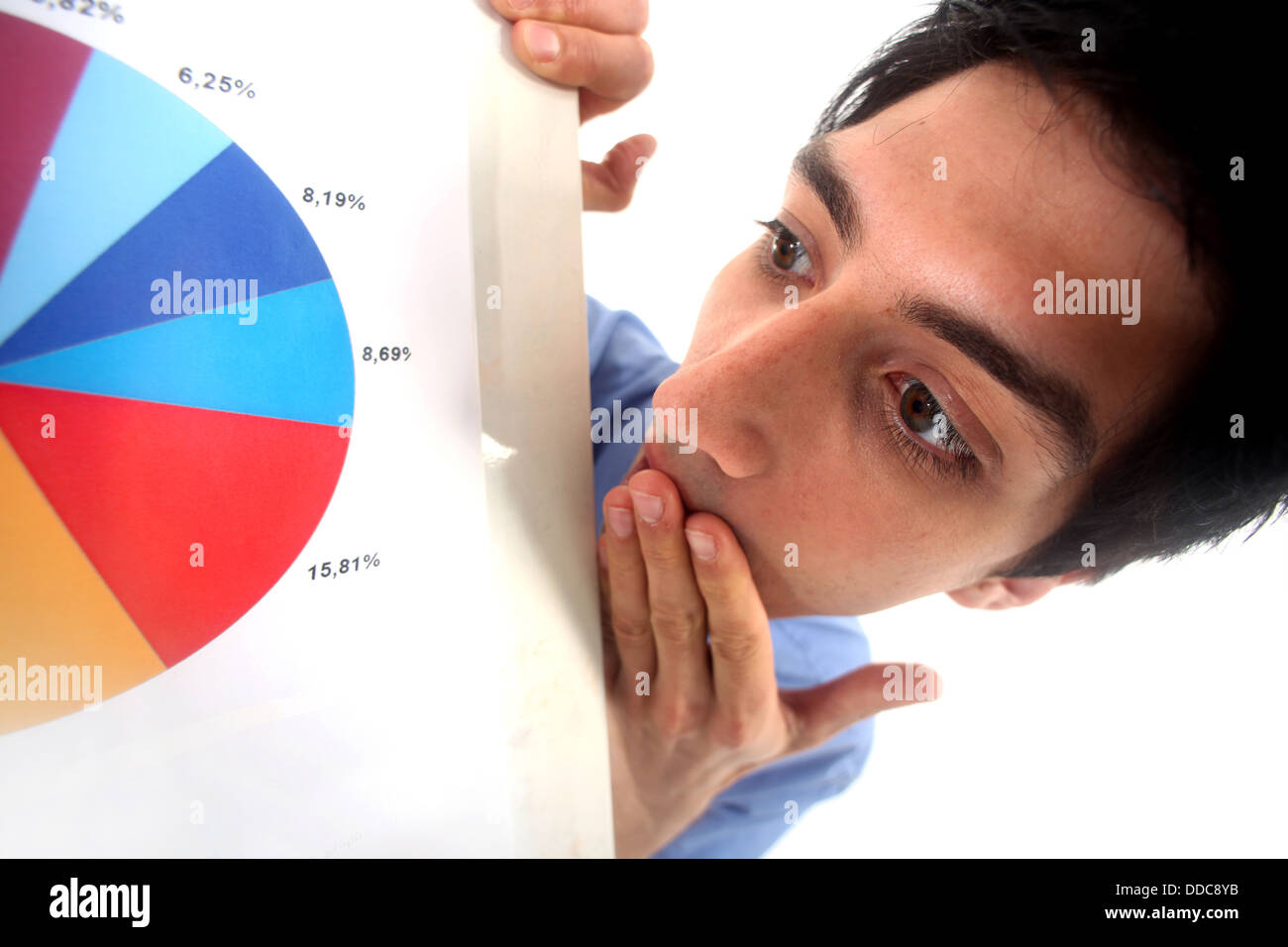 Surprised man looking at graph Stock Photo - Alamy