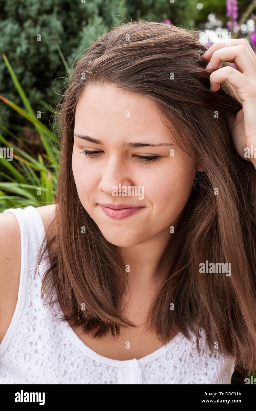 Thoughtful pretty young woman hi-res stock photography and images - Alamy