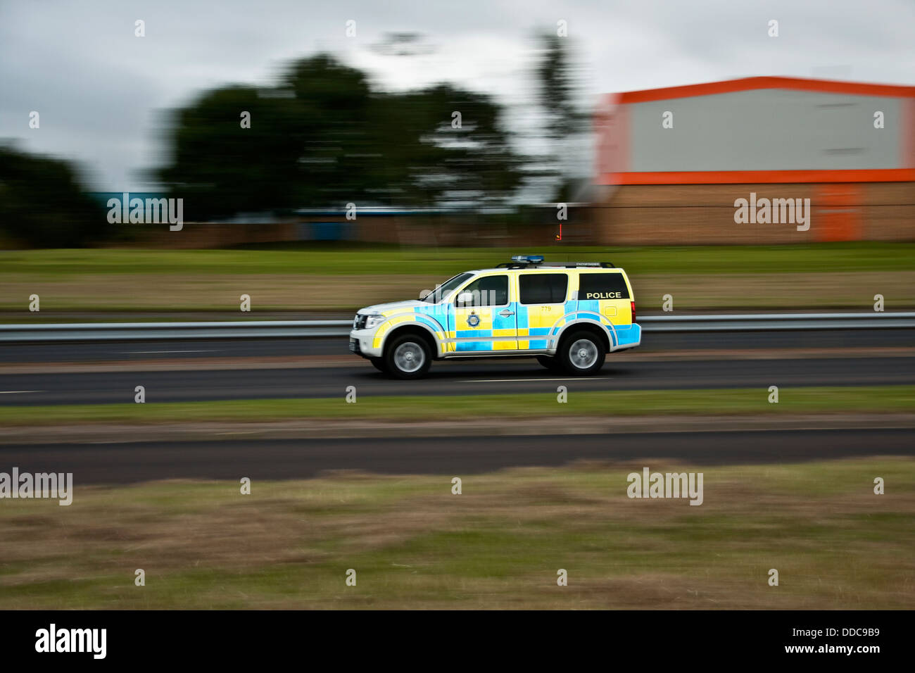 Panning with rear sync flash of a police car while speeding along the ...