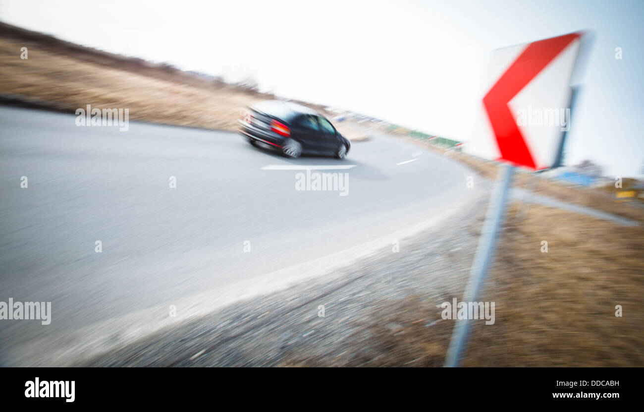Traffic concept: car driving fast through a sharp turn Stock Photo - Alamy