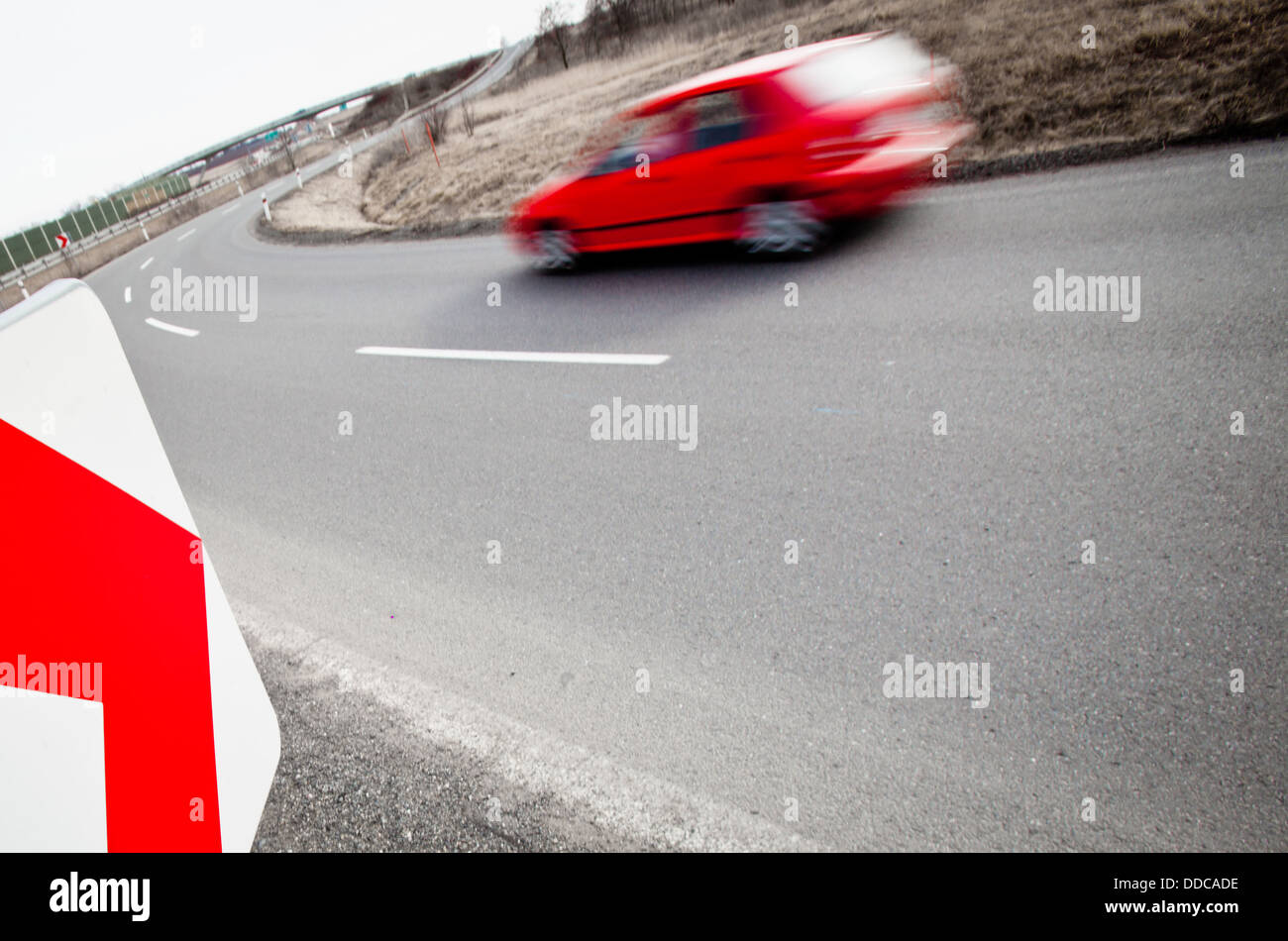 Traffic concept: car driving fast through a sharp turn Stock Photo - Alamy