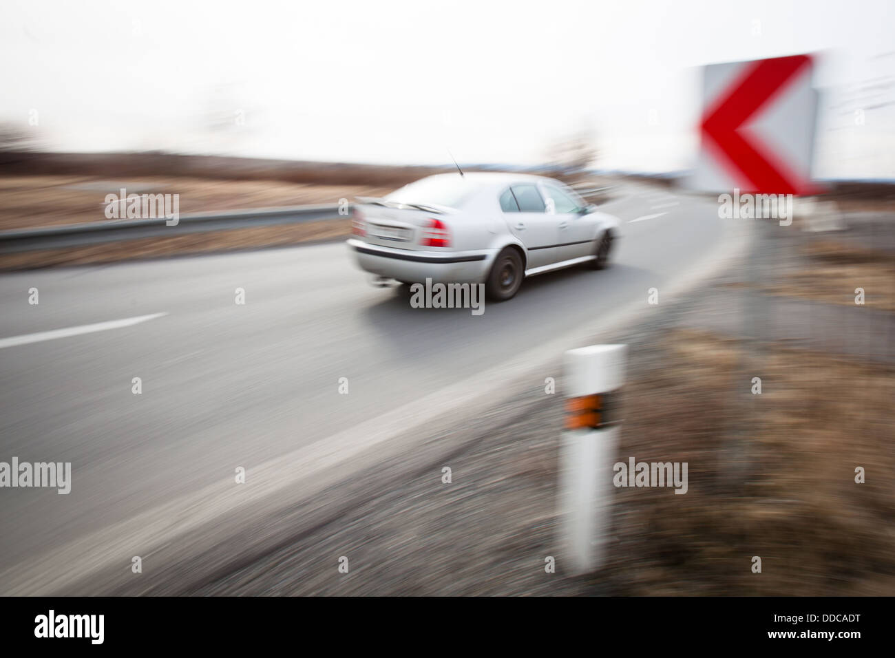 Traffic concept: car driving fast through a sharp turn Stock Photo - Alamy