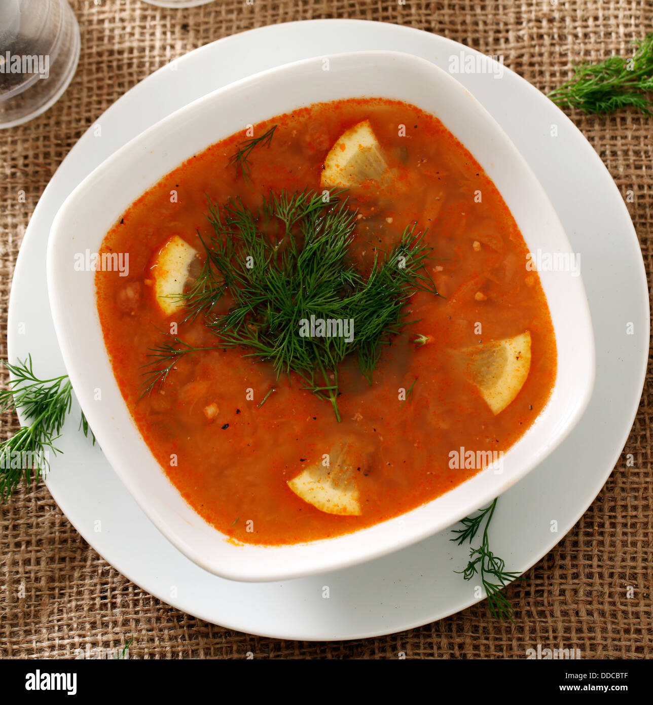 Image of bowl of hot red soup served Stock Photo - Alamy