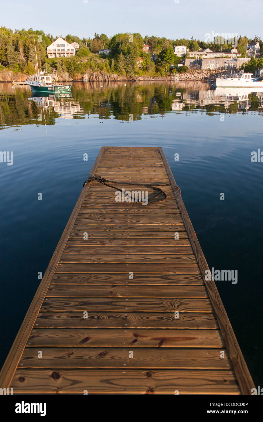 A dinghy dock reaches into the harbor in South West Harbor, Mount ...