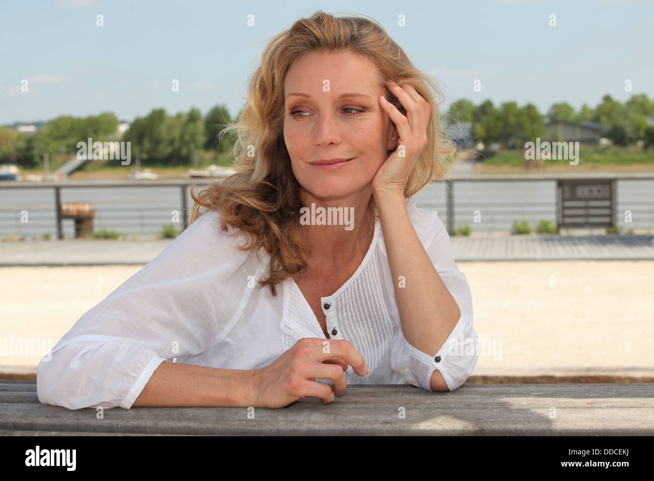 Woman resting outside Stock Photo - Alamy