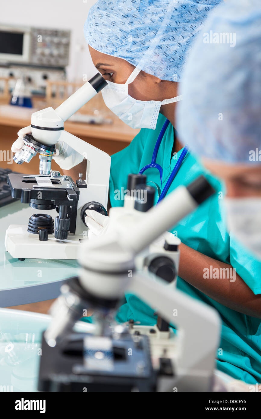 Indian doctor with microscope hi-res stock photography and images - Alamy