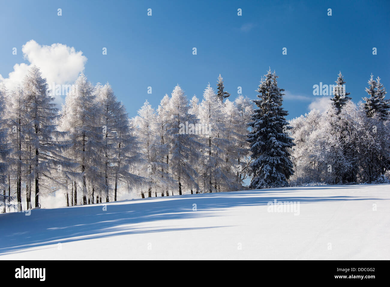 Snowy mountain scenery with deep blue sky Stock Photo - Alamy