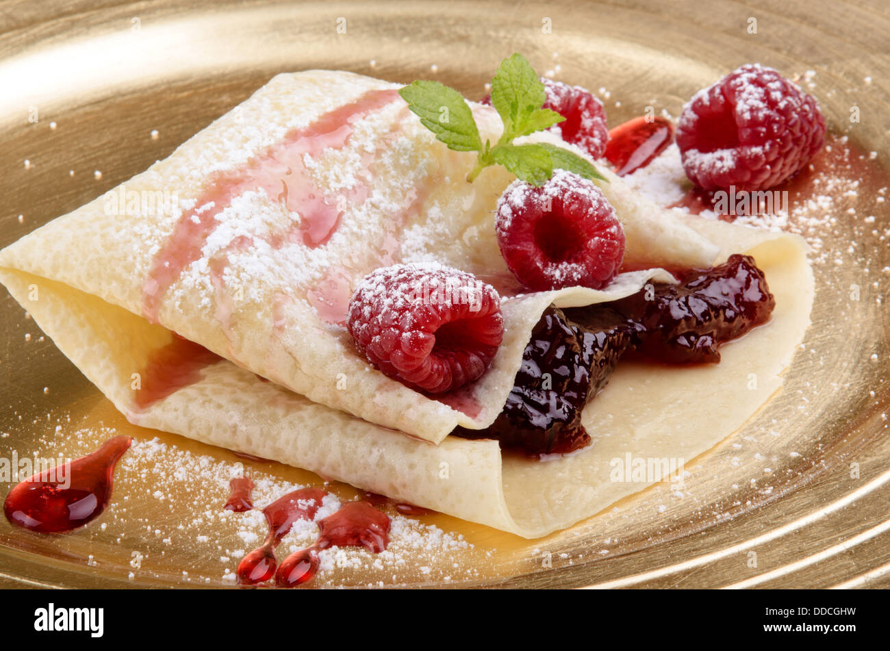 crepe with raspberries and jam Stock Photo - Alamy